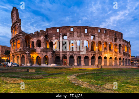 view of Colosseum illuminated at twilight in Rome, Italy Stock Photo ...