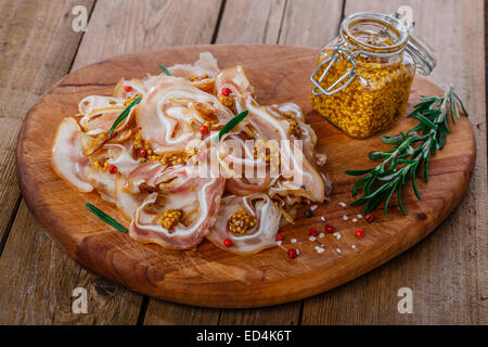 smoked pig ears cut with Dijon mustard Stock Photo - Alamy
