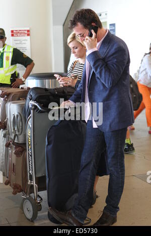 (L-R) Sara Wells and Noah Wyle arrive for the 77th annual Primetime ...
