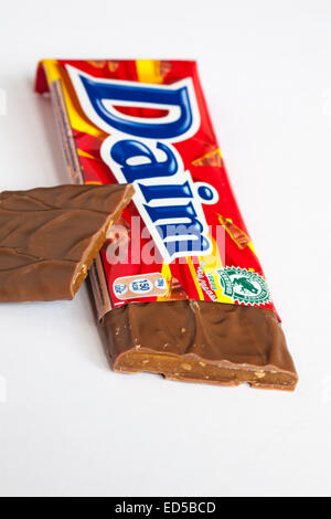 Daim chocolate bar opened to show contents set on white background ...