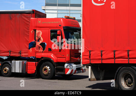 Back view Trucks Lorries & articulated flat bed trailers overtaking ...