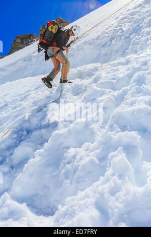 Mountaineer abseiling from Mt Col Blanc onto the Plateau du Trient ...