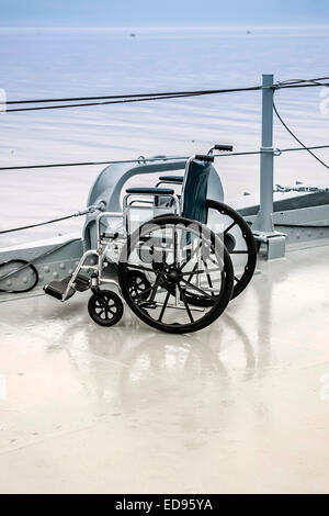 Empty wheelchair for disabled special needs passengers on airport ...