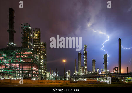 Lightning bolts striking oil refinery at industrial estate during heavy ...