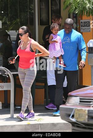Reggie Bush with his wife Lilit Avagyan and baby daughter Briseis leave ...