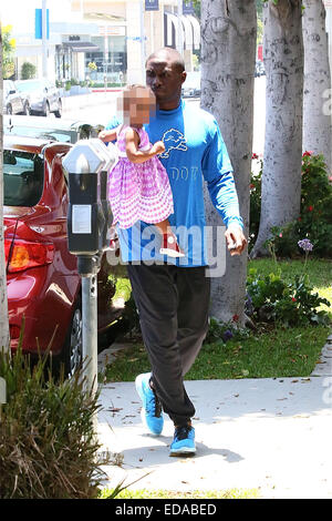 Reggie Bush with his wife Lilit Avagyan and baby daughter Briseis leave ...