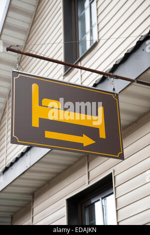 Accommodation Sign on Wooden Hut Facade Stock Photo - Alamy