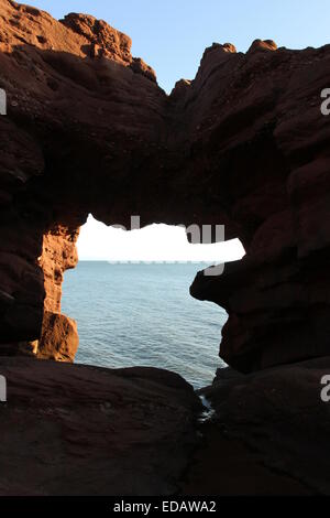 Needle E'e rock arch in red sandstone Seaton Cliffs Angus Scotland ...