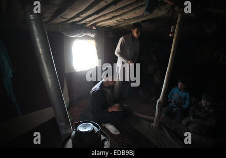 Kabul, Afghanistan. 3rd Jan, 2014. People stay at home in a slum in ...