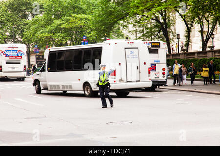 New York City cop directing traffic at busy intersection USA Stock ...