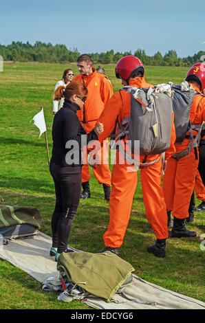 Parachutists - 2014. Check of parachutes before jumps Stock Photo - Alamy