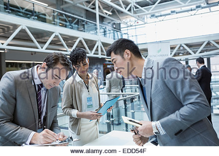 Conference registration table Stock Photo - Alamy
