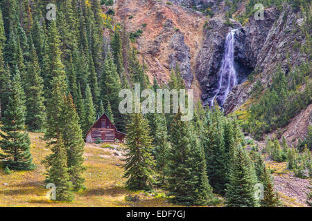 Cabin and waterfall along the Alpine Loop road in the San Juan ...