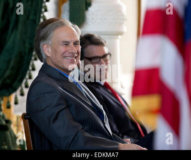 Texas Governor-elect Greg Abbott waves after his victory speech Tuesday ...