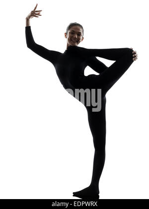 one woman contortionist practicing gymnastic yoga in silhouette on ...