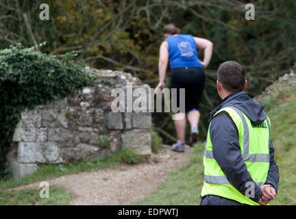 Race marshall at a cross country running event, Staffordshire, England ...