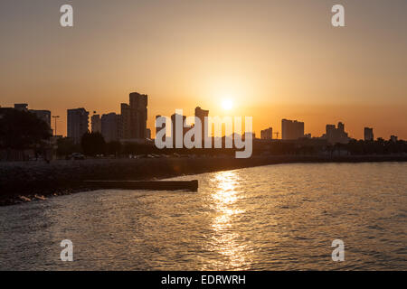 The skyline of Kuwait City at sunset, Kuwait Stock Photo - Alamy