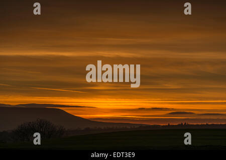 A view towards Whernside from the A66 at sunset Stock Photo - Alamy
