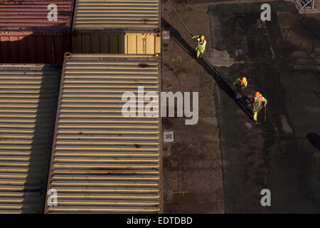 Dockers tying up the Panama-registered container ship MSC Sandra, at ...