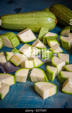 cutting marrow in pieces on wood table for cooking Stock Photo - Alamy
