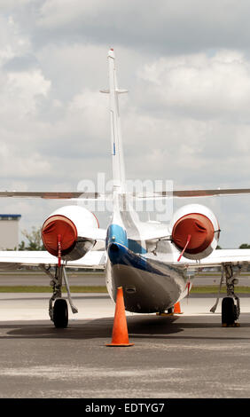 Rear view of a parked small plane on a sunset background. Silhouette of ...