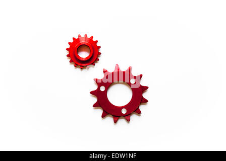 A vintage red machine with gears, set amidst lush greenery in Villeta ...