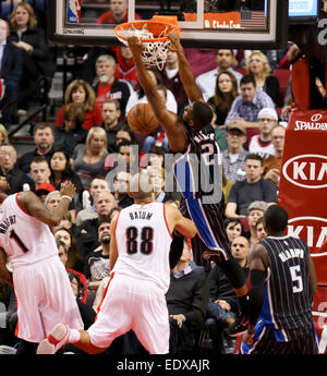 Portland Trail Blazers' Maurice Harkless, right, goes to the basket ...