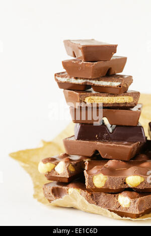 stack of assortment delicious chocolate bars with different flavors ...