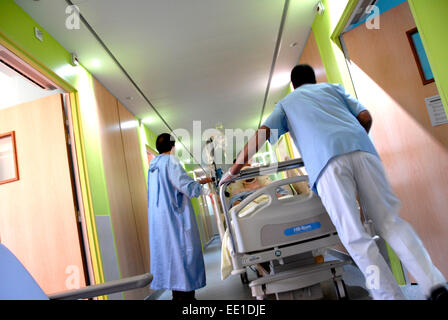 Cardiac intensive care. Male patient recovering in a cardiac intensive ...