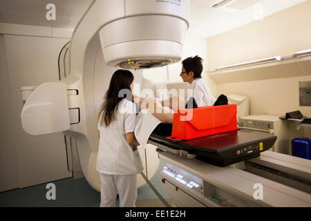 Prostate cancer radiotherapy surgery. Patient under general anaesthetic ...