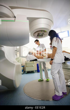 Prostate cancer radiotherapy surgery. Patient under general anaesthetic ...