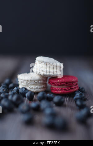 fresh macaroons and ripe blackberry on a wooden background Stock Photo ...