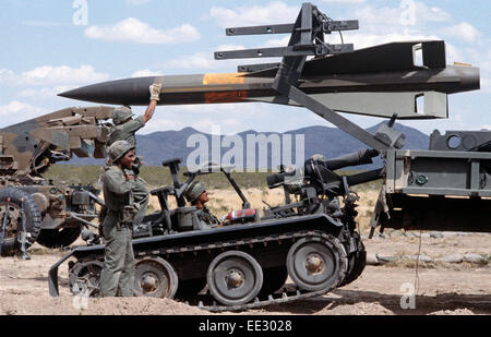 HAWK MISSILE BEING LOADED BY AMERICAN ARMY SOLDIERS ONTO LAUNCHER ...