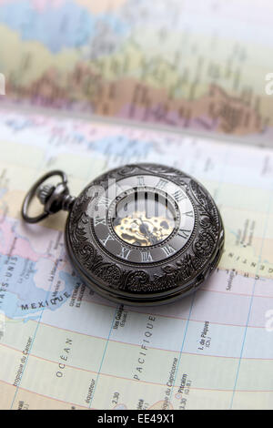 Photo of old watch on map Stock Photo - Alamy
