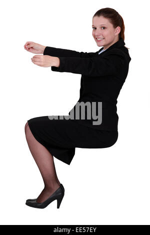 Businesswoman holding an invisible object Stock Photo - Alamy
