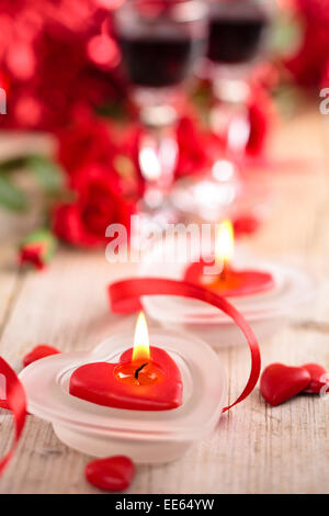 Beautiful candles with flowers on wooden background Stock Photo - Alamy