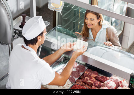 Woman Choosing Meat At Deli Counter In Morrisons Store At Beccles ...