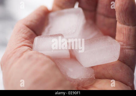 Hand Holding Melting Ice Cubes Stock Photo - Alamy