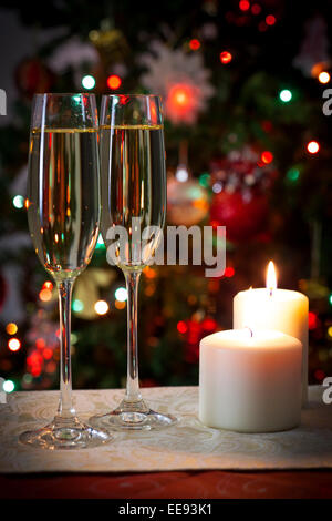 Glass of champagne and a burning candle on a blurred background Stock ...