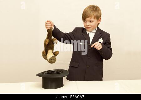Young Boy Magician Performing Magic Trick Stock Photo - Alamy