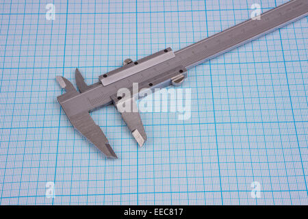 caliper on graph paper background Stock Photo - Alamy