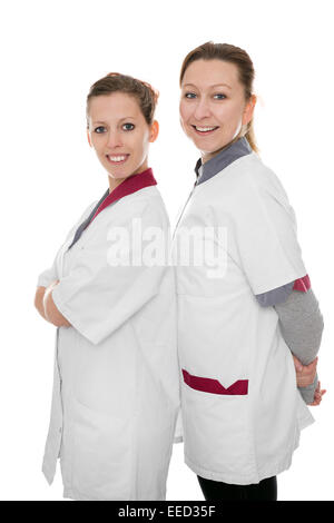 two nurses smiling to the viewer, isolated on white Stock Photo - Alamy