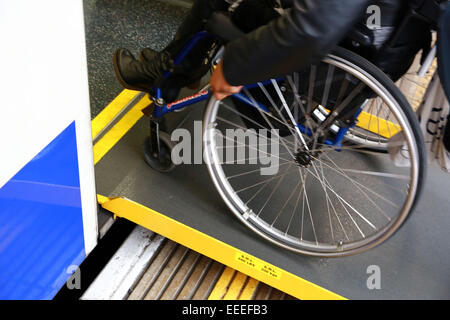Wheelchair user boarding a London Underground train Stock Photo - Alamy