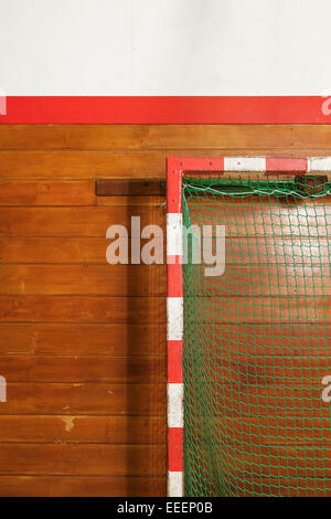 Indoor Sports Goalpost in Gymnasium with Wooden Wall, Red and White Net ...