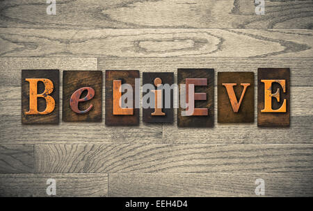 The word Believe concept and theme written in black ink on a colorful ...