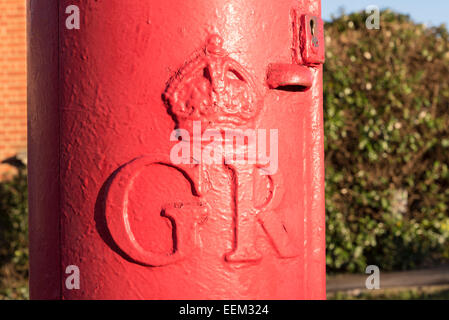 Close up of a George V monogram on a red post box outside Cheshunt ...