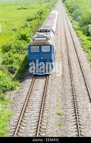 railway tracks background with incoming train Stock Photo - Alamy