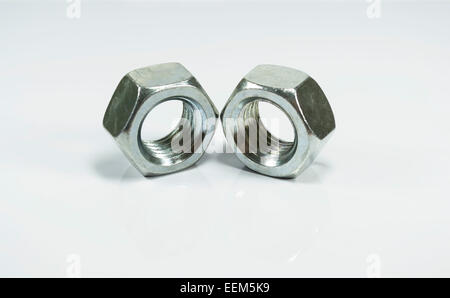 Big metallic, hexagonal nuts , one placed horizontally and another ...