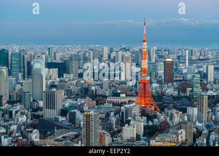 Tokyo Tower stands out among the Tokyo cityscape as evening approaches ...