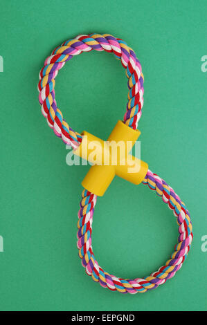 Dog rope toys on yellow background Stock Photo - Alamy